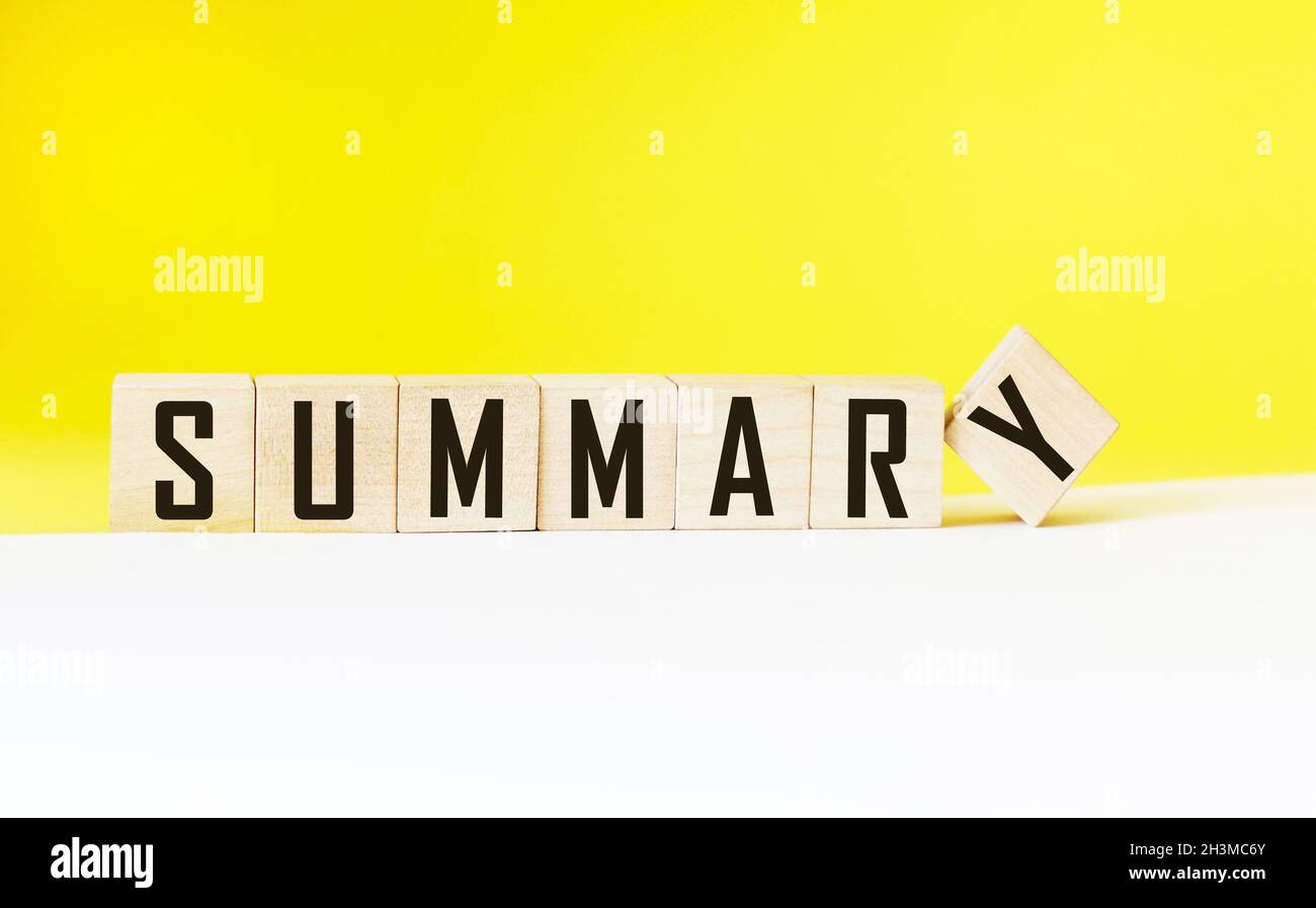 SUMMARY word on wooden cubes and white and yellow background Stock ...