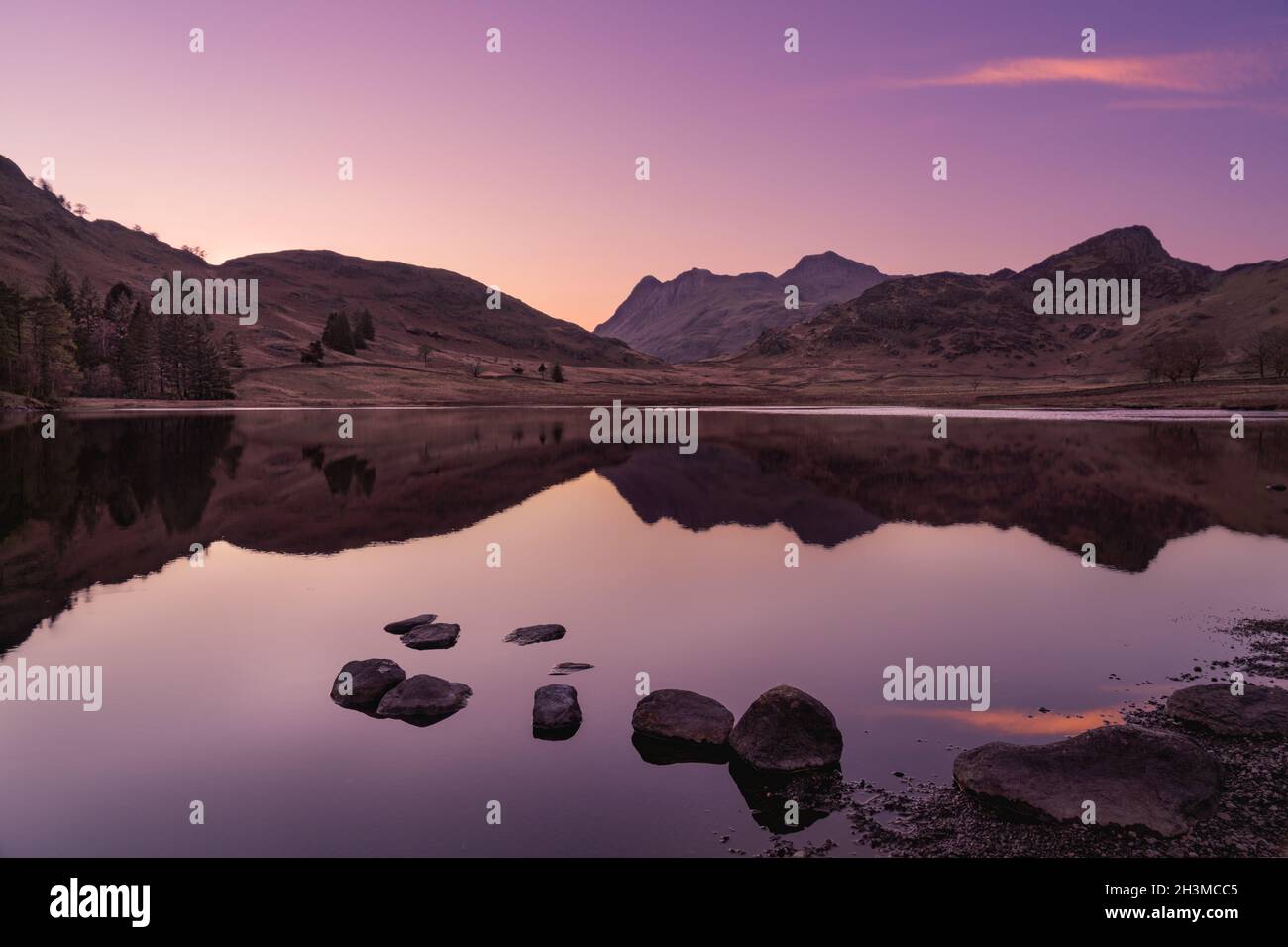 Sunset at Blea Tarn looking out towards the Langdale Pikes in the Lake ...