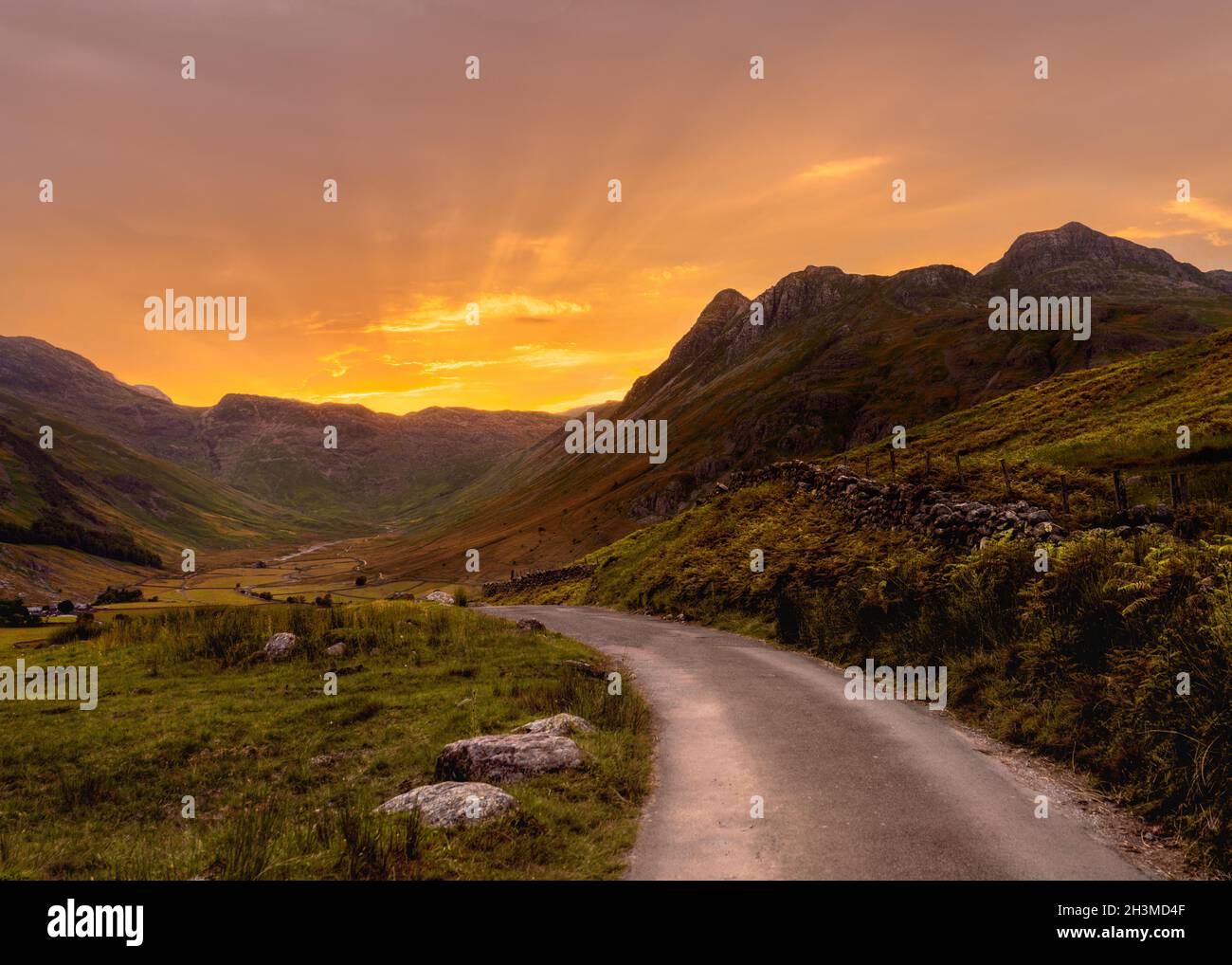 The Langdale Pikes at sunset from the Blea Tarn road at Side Pike fell ...