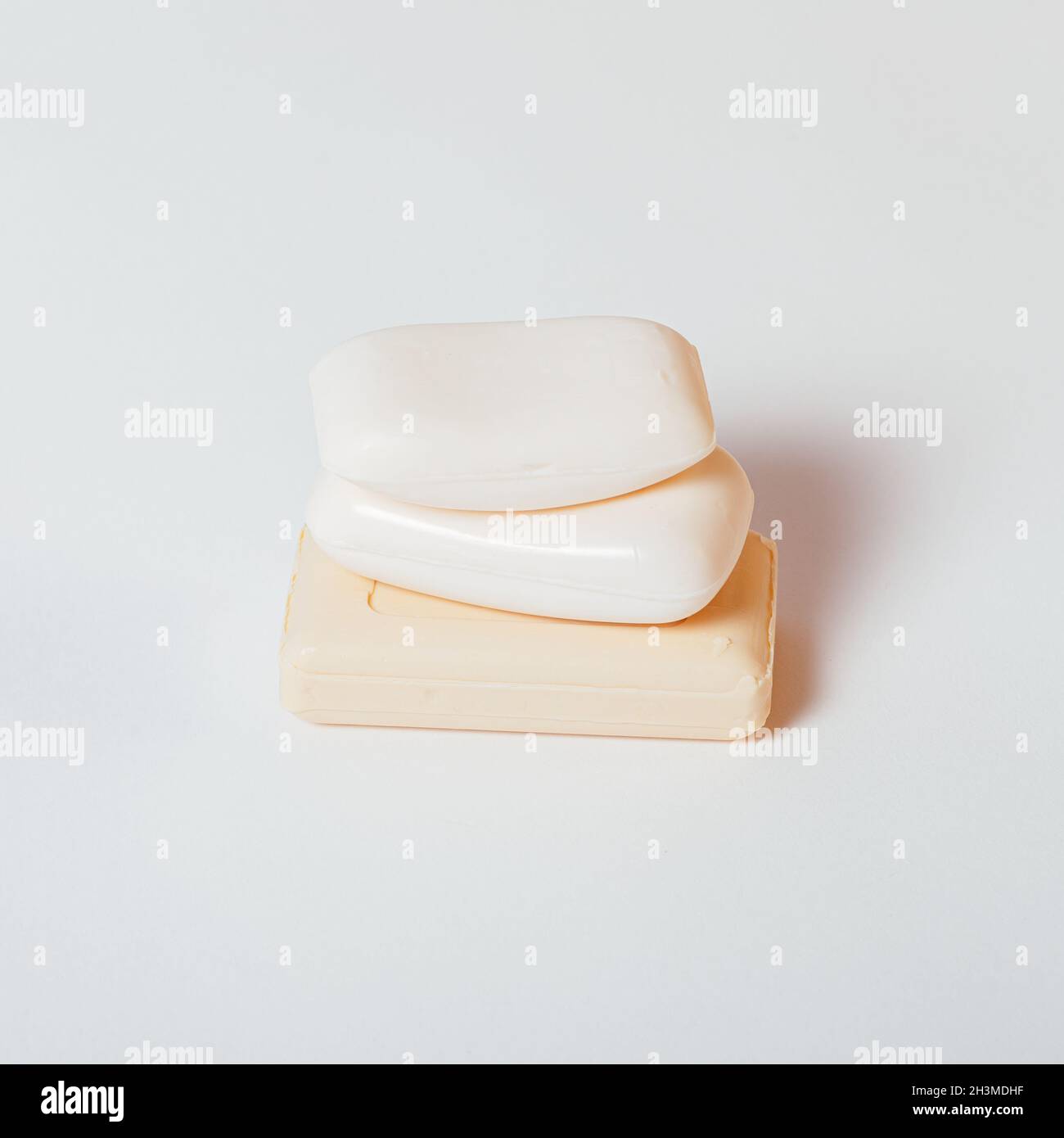 Natural soap bars stack on white background, close-up. Simple cosmetics ...