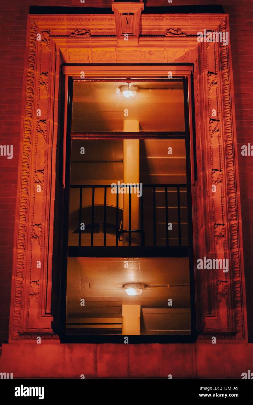 Window illuminated with bright red light, London, England, UK Stock ...