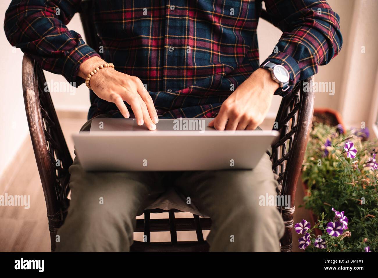 Midsection of man using laptop computer at home Stock Photo - Alamy