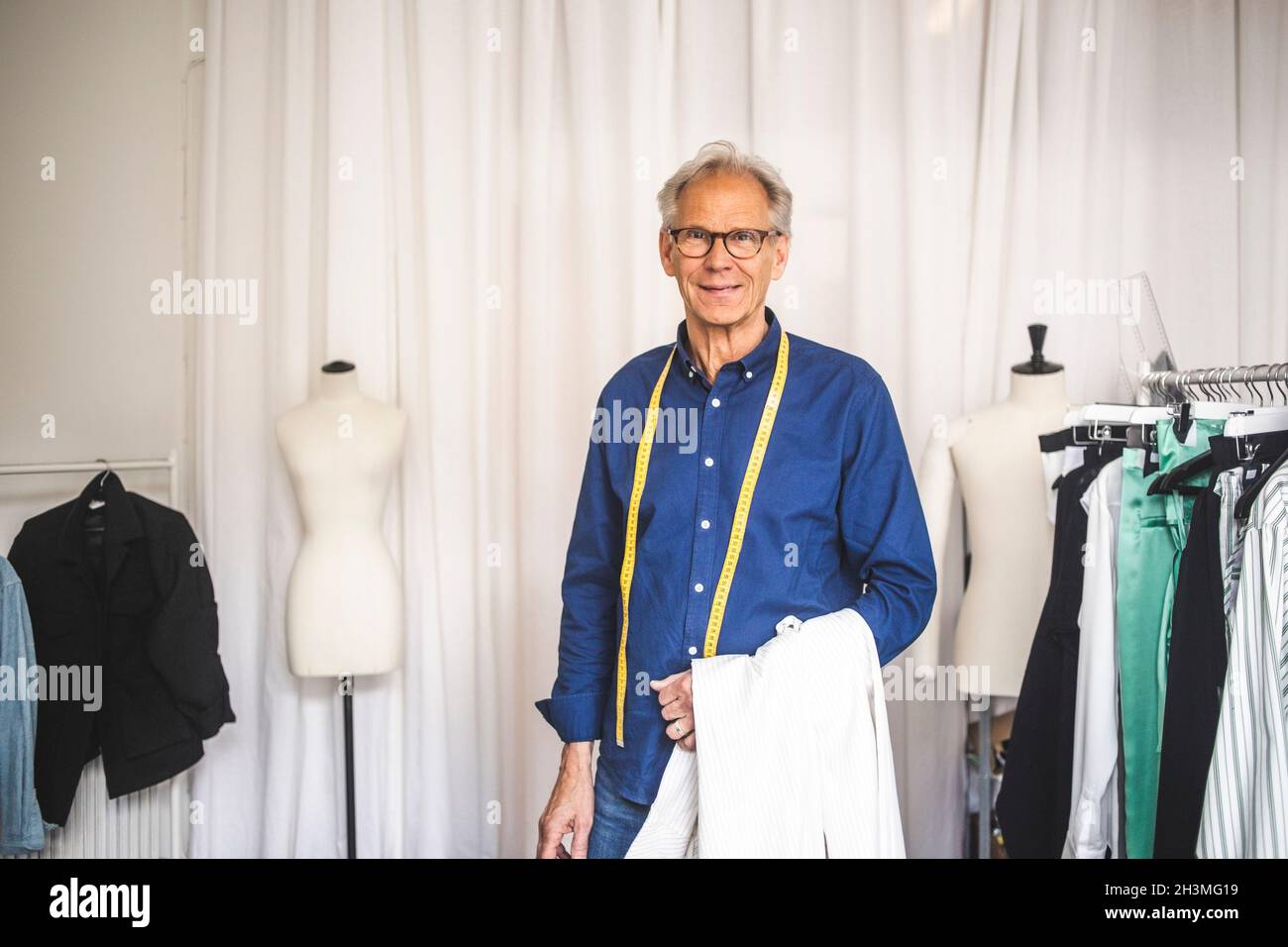 Portrait of male owner in boutique Stock Photo - Alamy