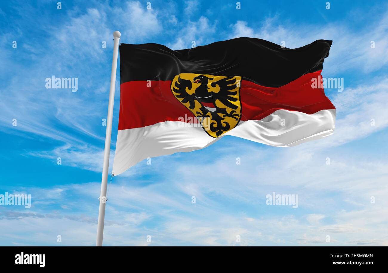 flag of Reutlingen at cloudy sky background on sunset, panoramic view ...