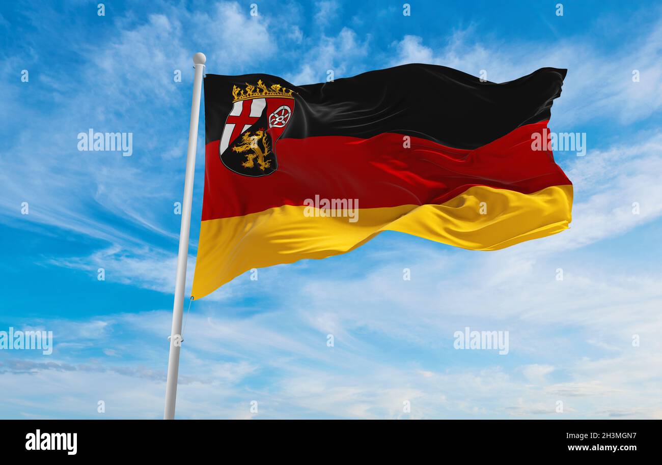 flag of Rhineland Palatinate at cloudy sky background on sunset ...