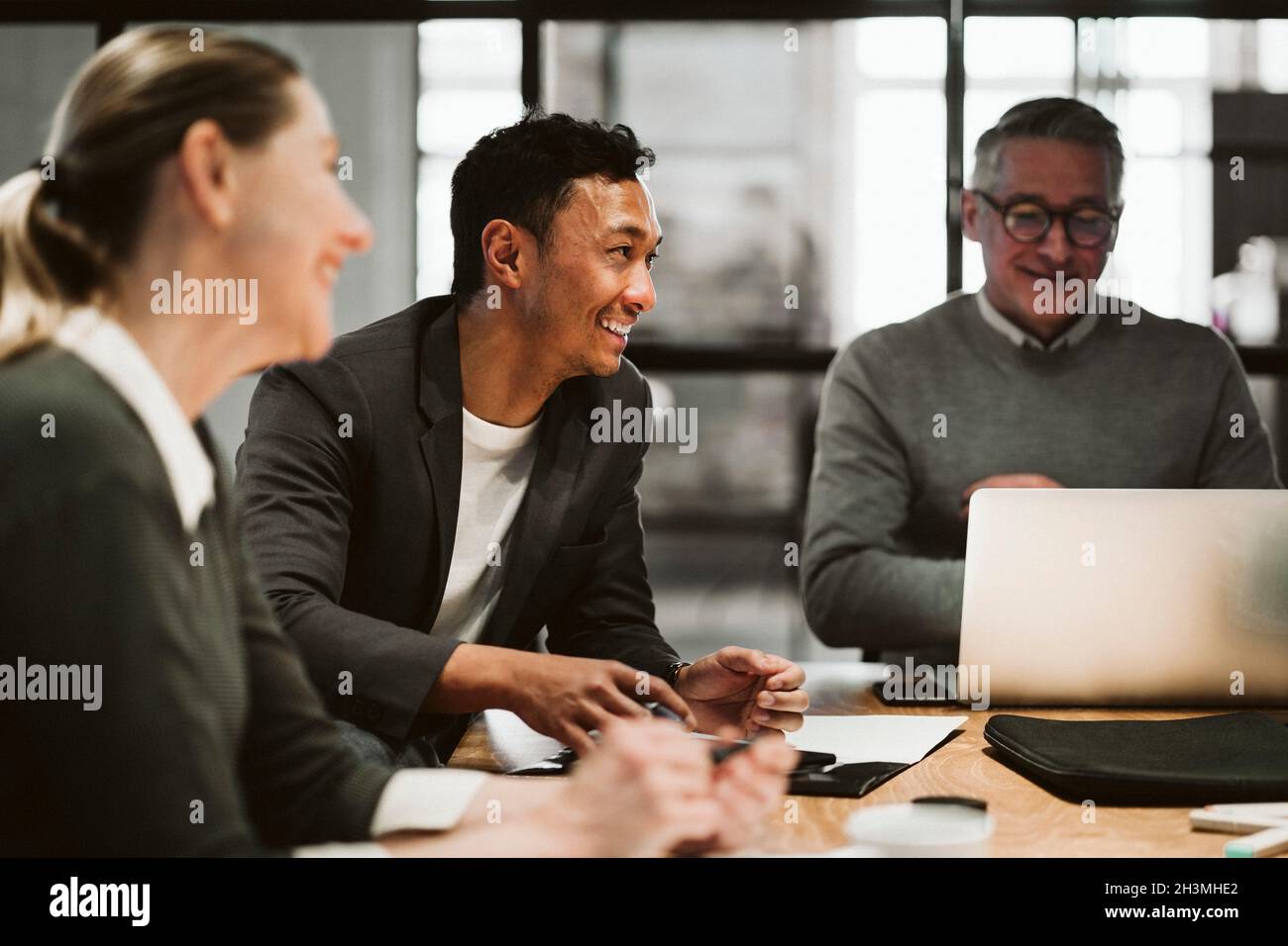 Happy three colleagues planning hi-res stock photography and images - Alamy