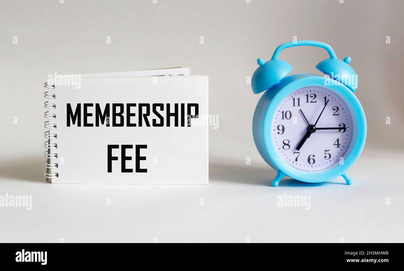 On notepad text about membership fee, business concept image on white ...