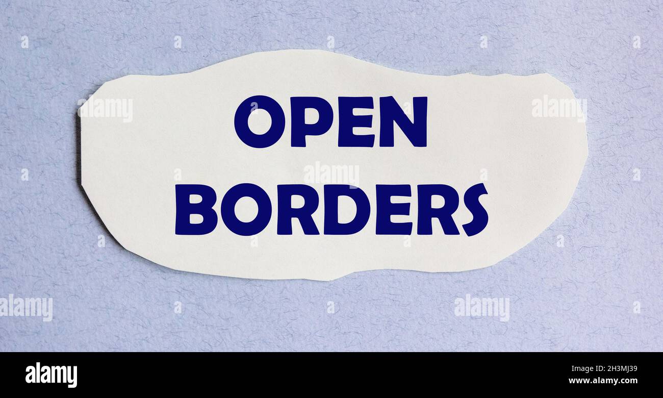 Opened borders, text on white paper and blue background Stock Photo - Alamy