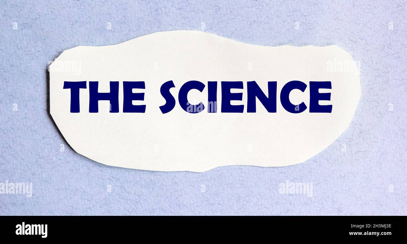 The text Science is written on torn white paper and a blue background ...