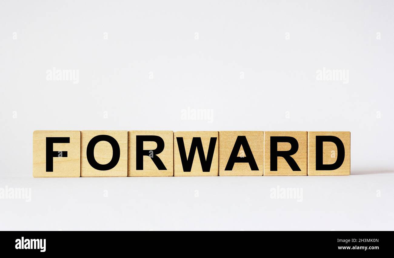 Word FORWARD on wooden cubes and white background. White background ...