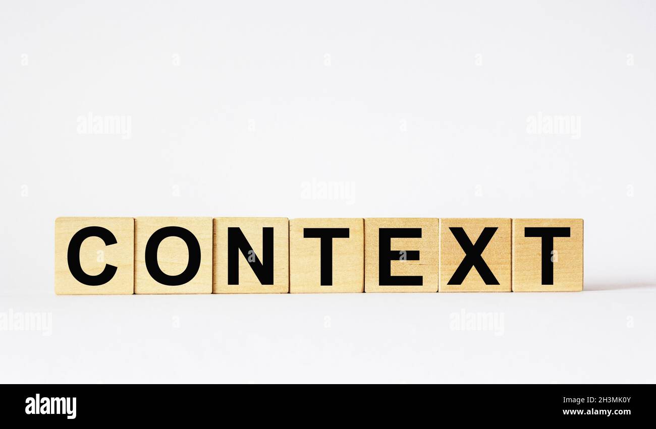 CONTEXT Word written on wooden cubes and a white background Stock Photo ...