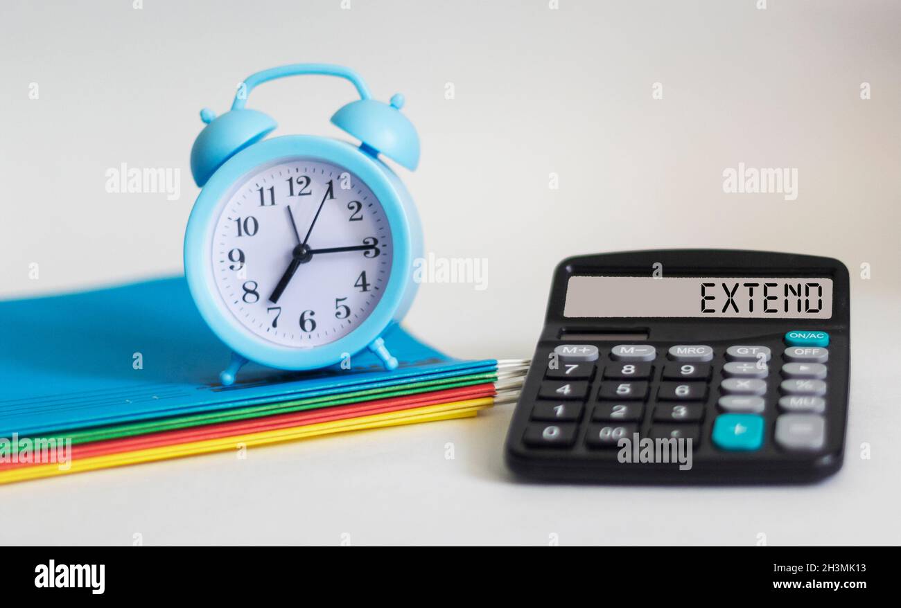 EXTEND word written on a calculator display and on a white background ...
