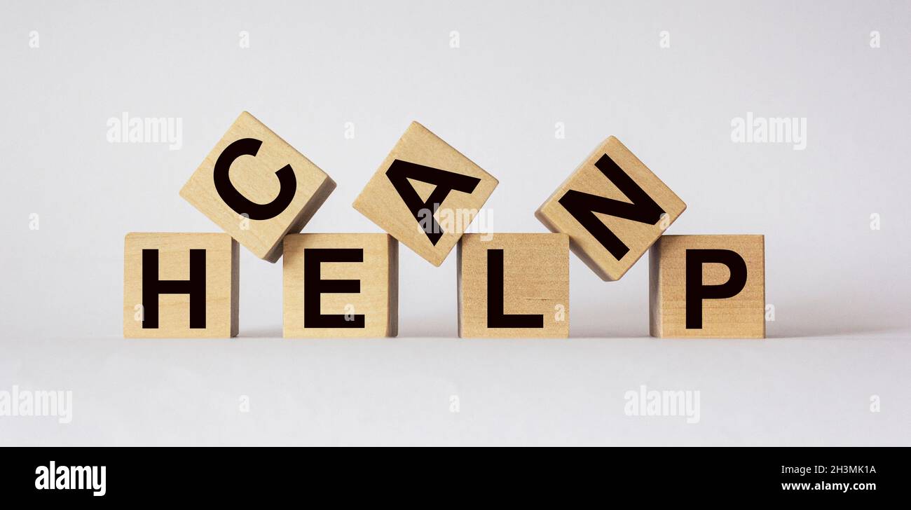 Can help, message on wooden blocks on white background Stock Photo - Alamy