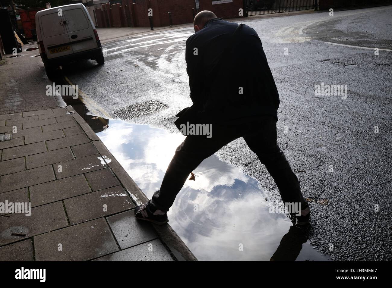 October 2021 - Street photographer shooting puddle reflections in ...