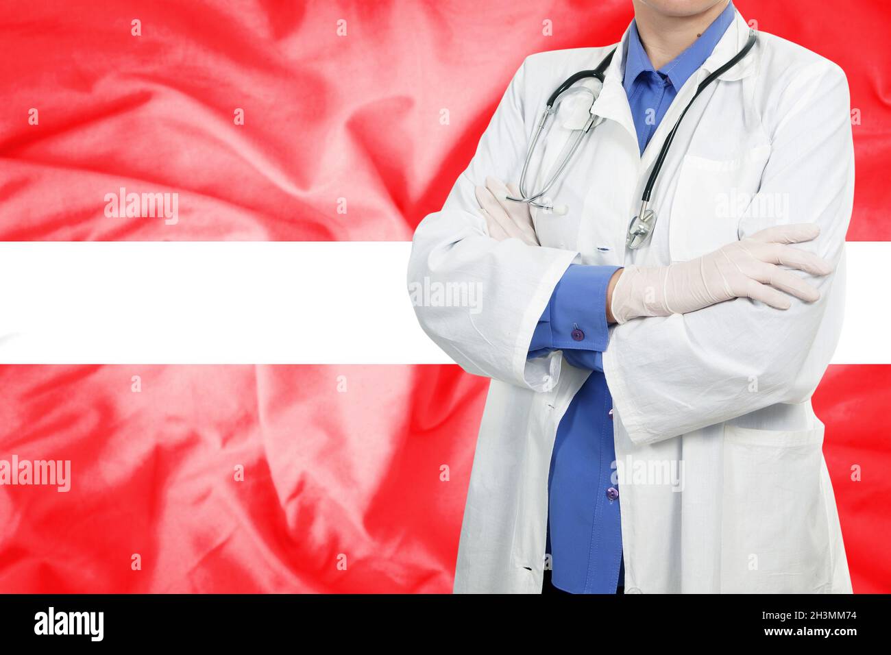Doctor standing with the flag Stock Photo - Alamy