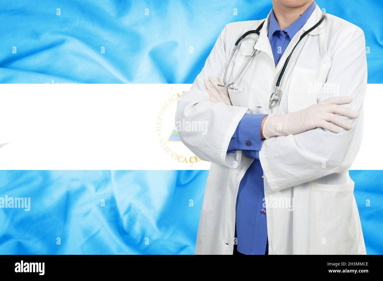 Doctor standing with the flag Stock Photo - Alamy