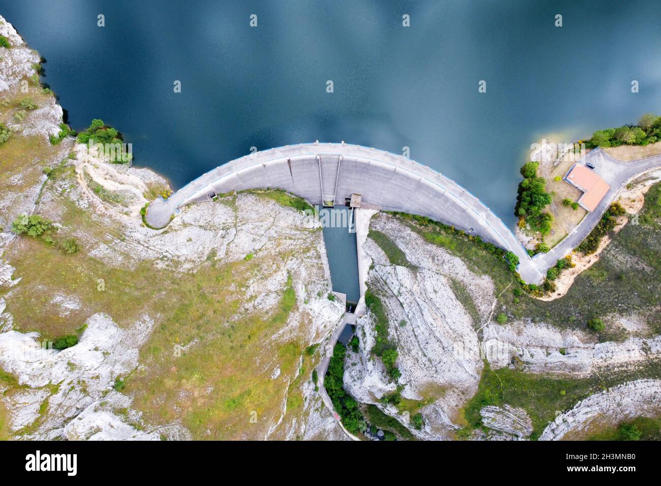 Aerial drone footage Water dam and reservoir lake, generating hydro electricity power renewable ...