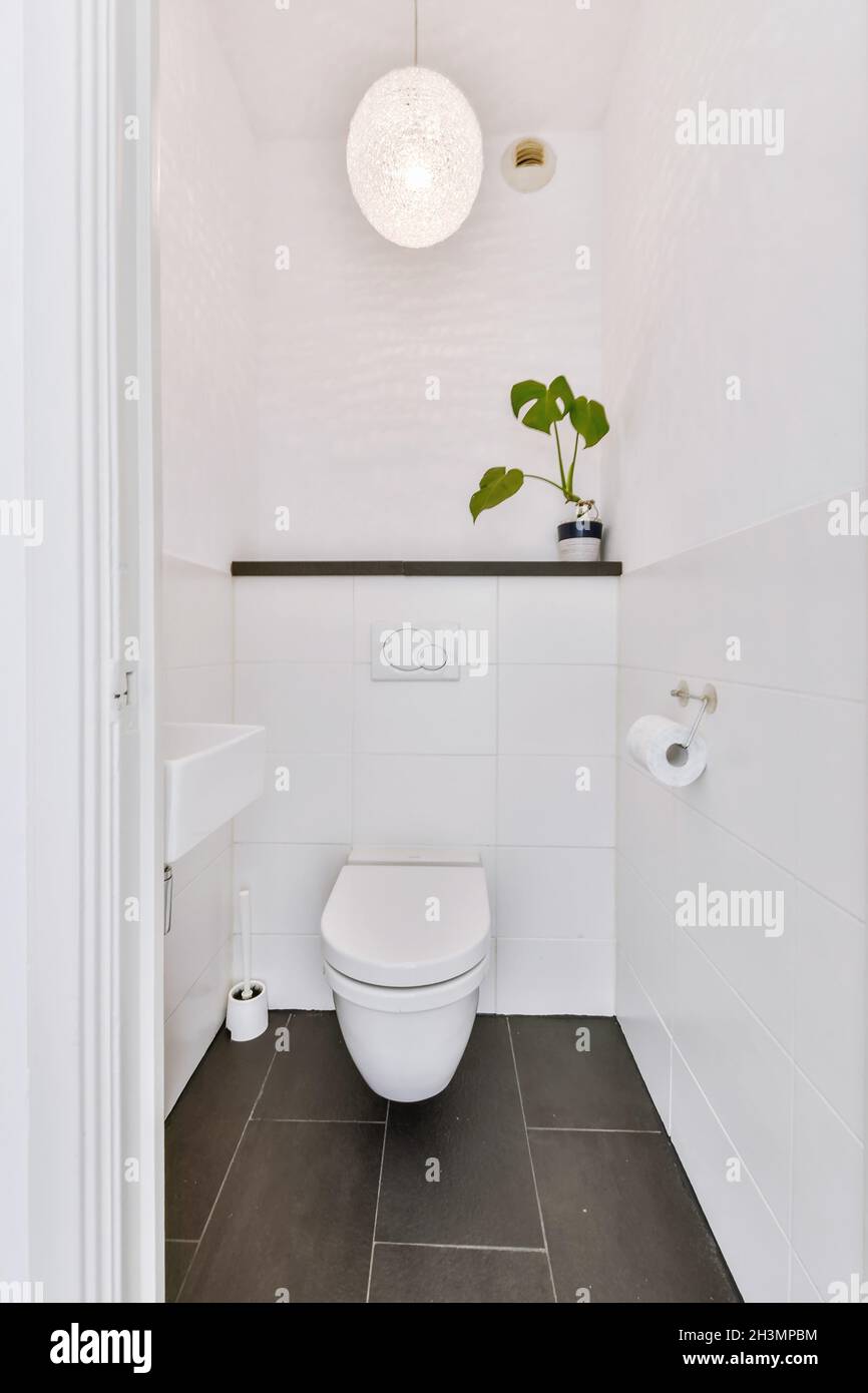 Interior of small clean restroom in miniature style Stock Photo - Alamy