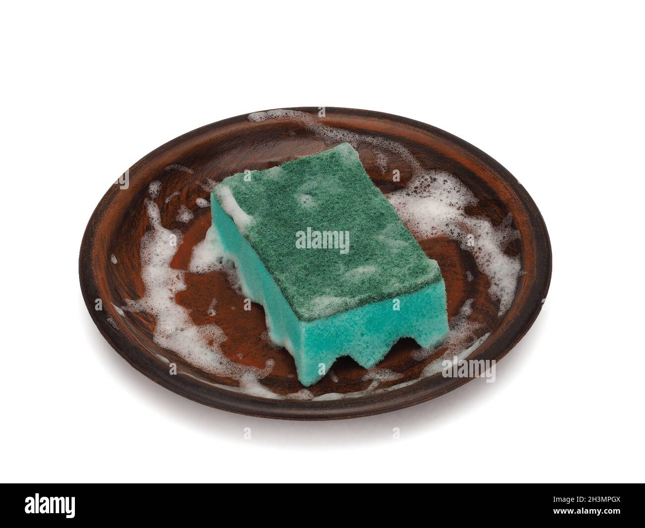 Scouring sponge in foam on a plate, dishwashing Stock Photo - Alamy