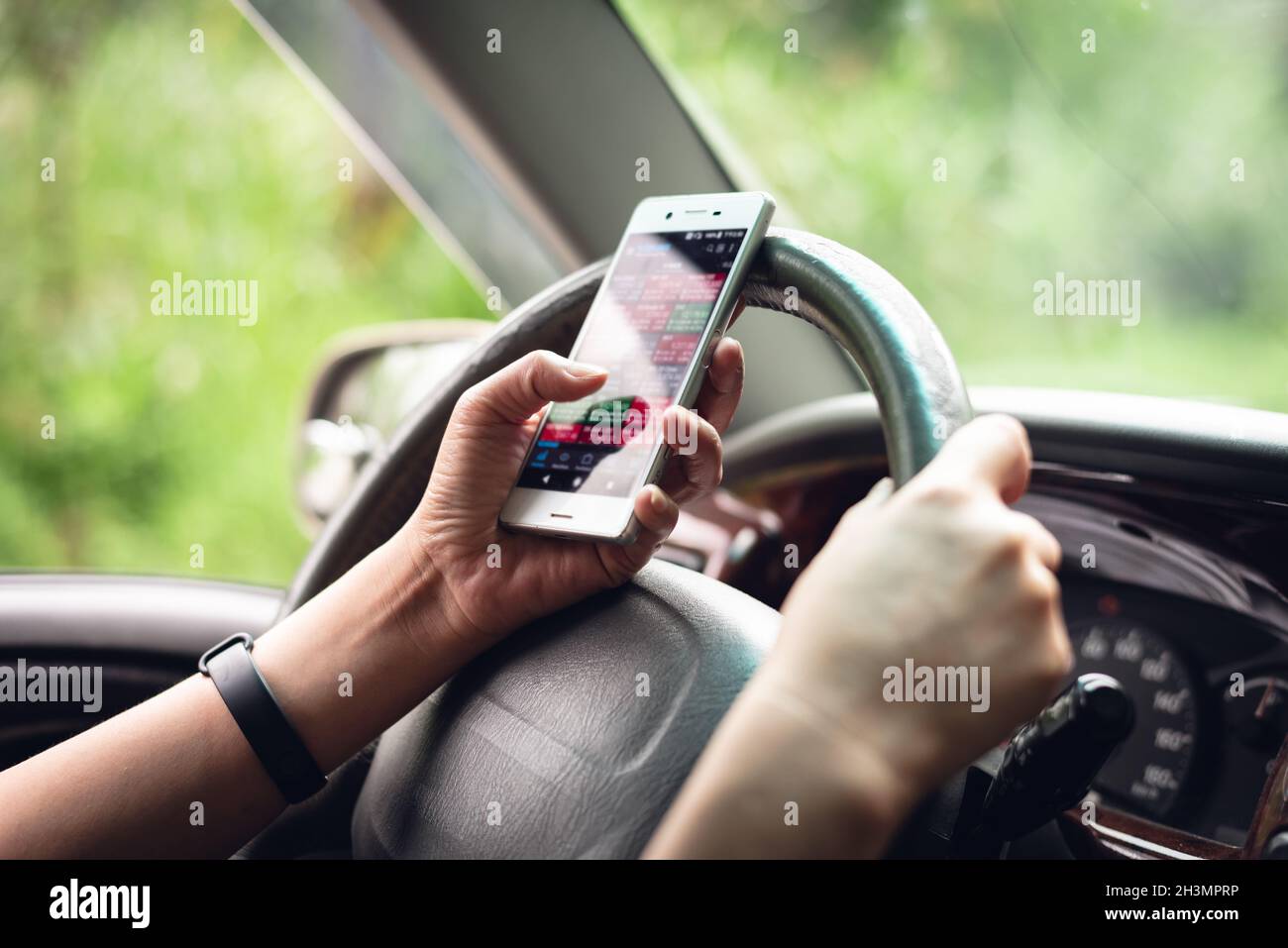 Woman using smartphone inside vehicle hi-res stock photography and ...