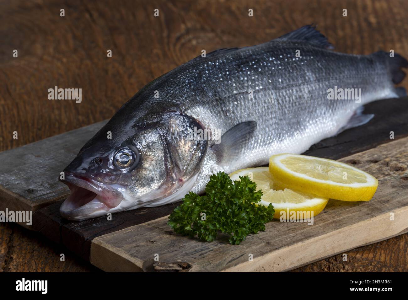One raw sea bass hi-res stock photography and images - Alamy
