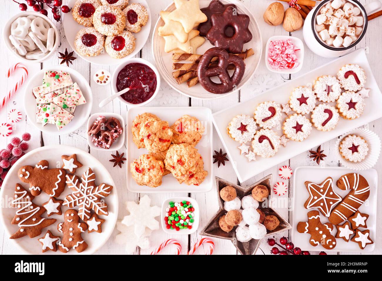 Christmas sweets and cookies. Top view table scene over a white wood ...