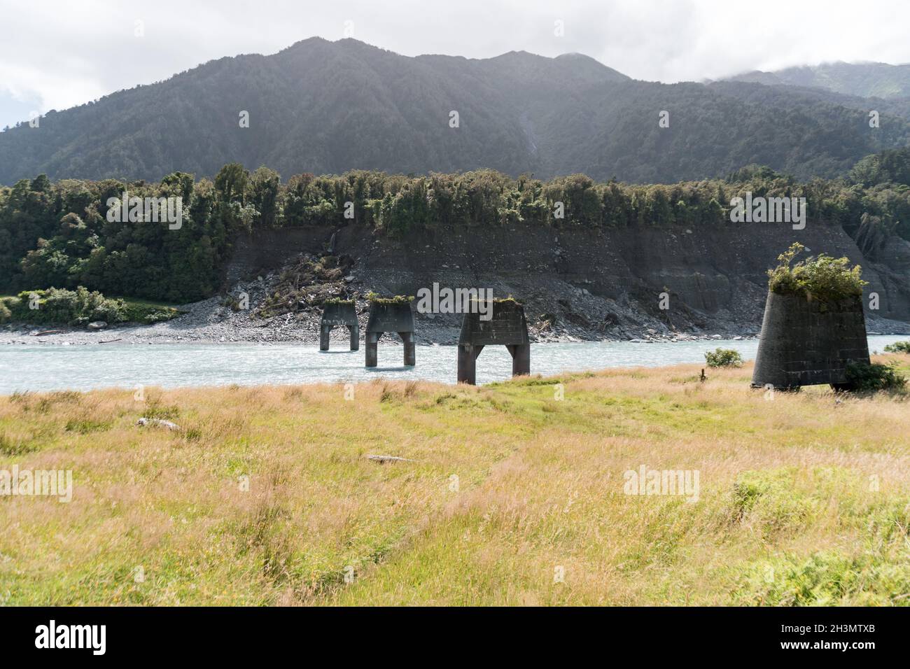 The ruins of bridge over the Whataroa River, New Zealand Stock Photo ...