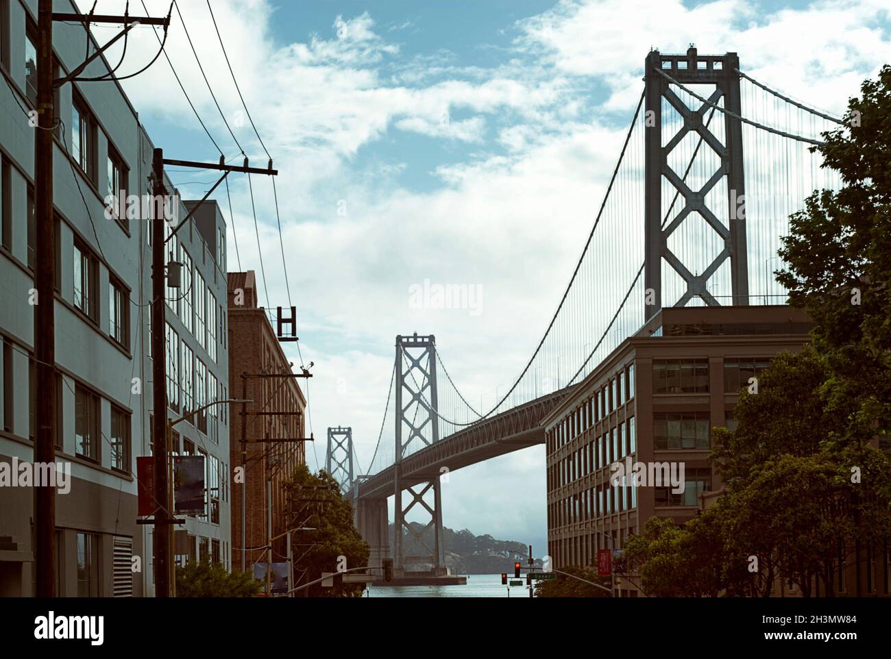 The Bay Bridge through some adjacent buildings Stock Photo - Alamy