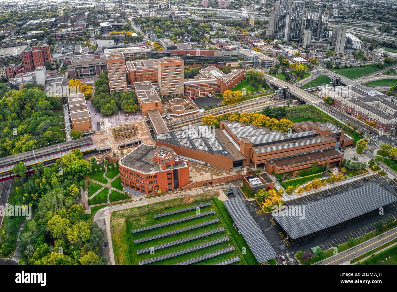 Aerial view of dense buildings and a large public University in ...