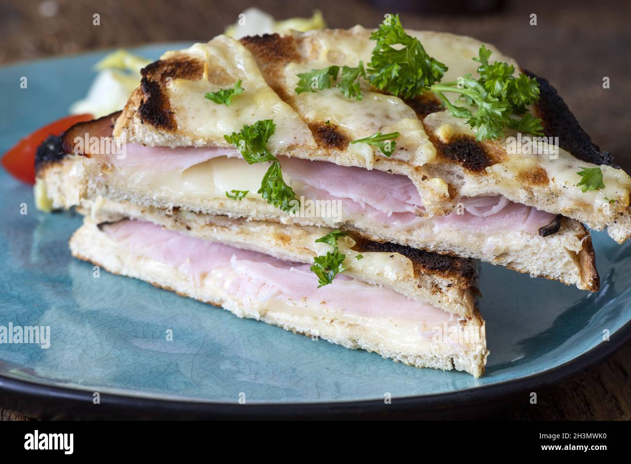 French Croque Monsieur on a blue plate Stock Photo - Alamy