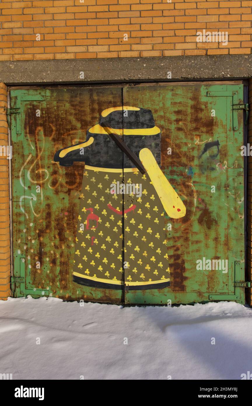 Vertical shot of gates with graffiti on a winter day Stock Photo - Alamy