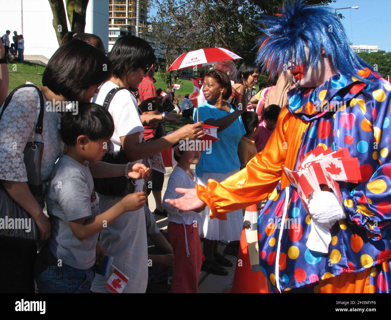 Toronto, Ontario / Canada - July 01, 2008: Clowns welcome multi-ethnic ...