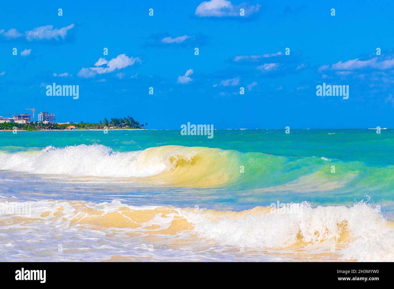 Tropical mexican beach with strong waves and clear turquoise blue water ...