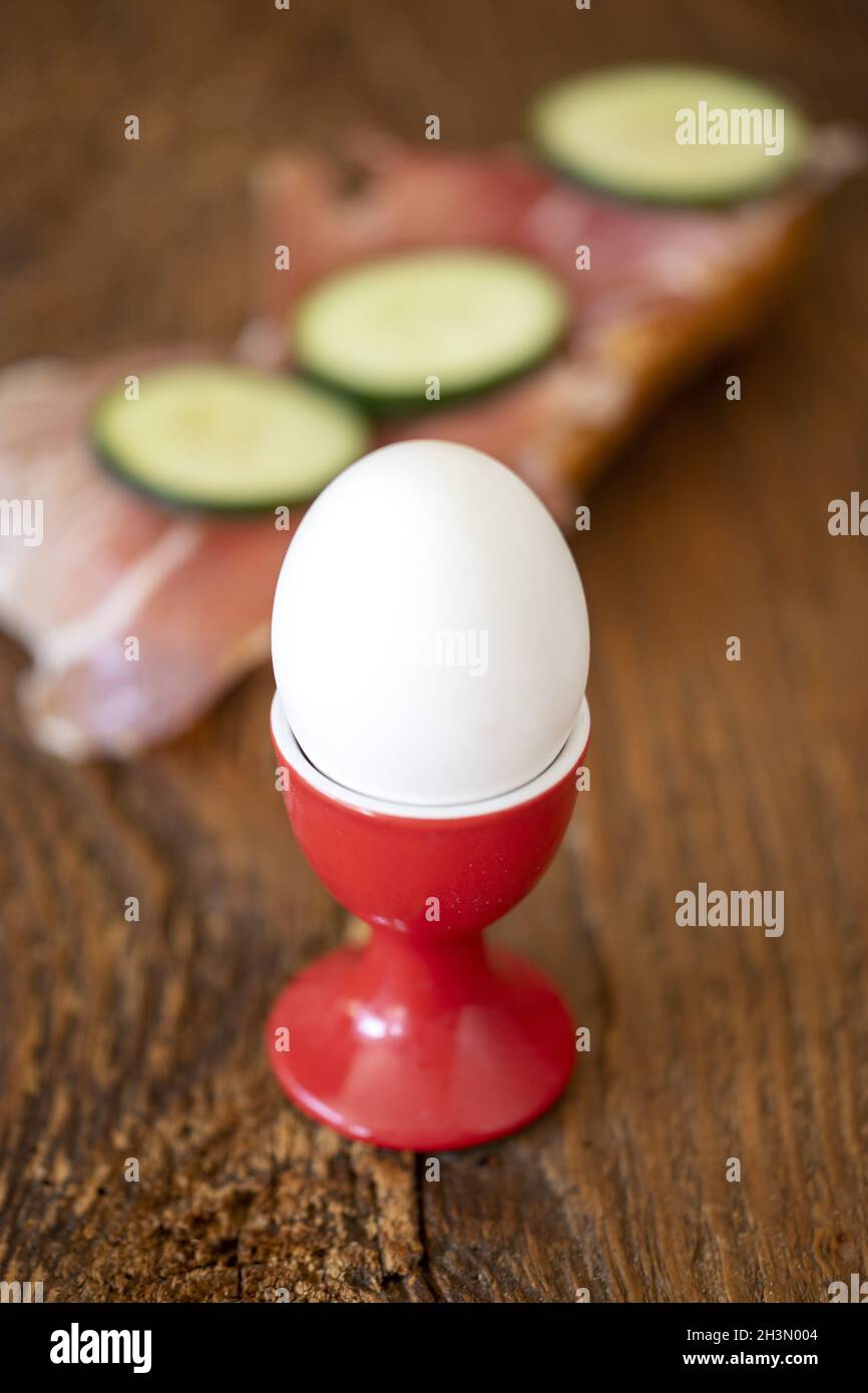 Boiled egg and bread with ham Stock Photo - Alamy