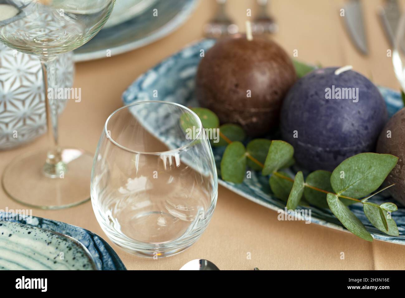Round candles, beautiful table setting close up Stock Photo - Alamy