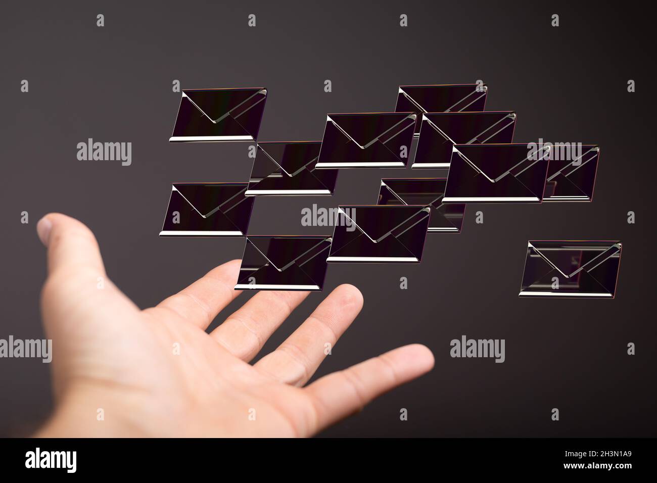 3D rendering of beige email icons with hand pointing at it from the ...