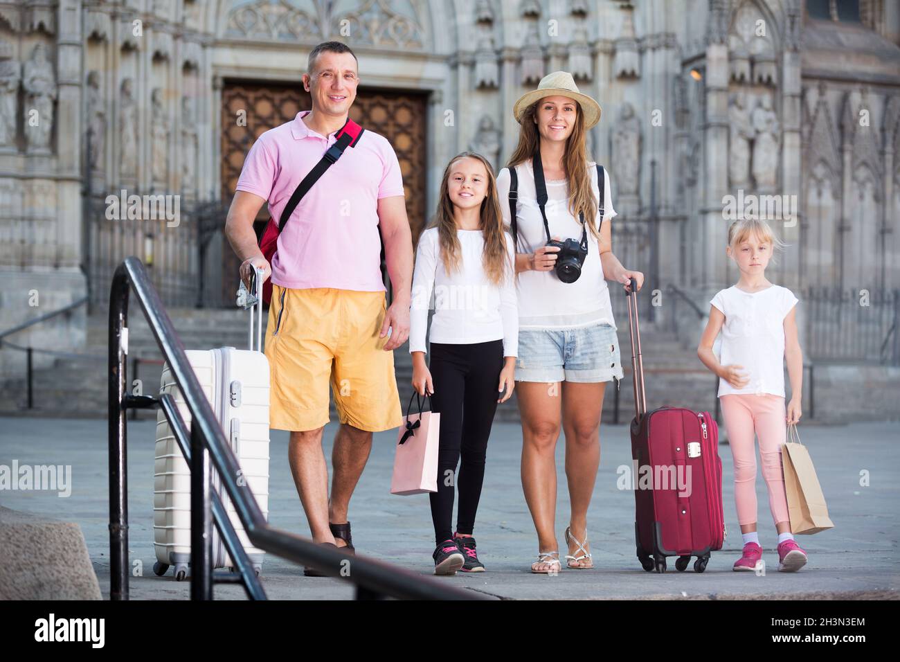 Big family of tourists strolling Stock Photo - Alamy