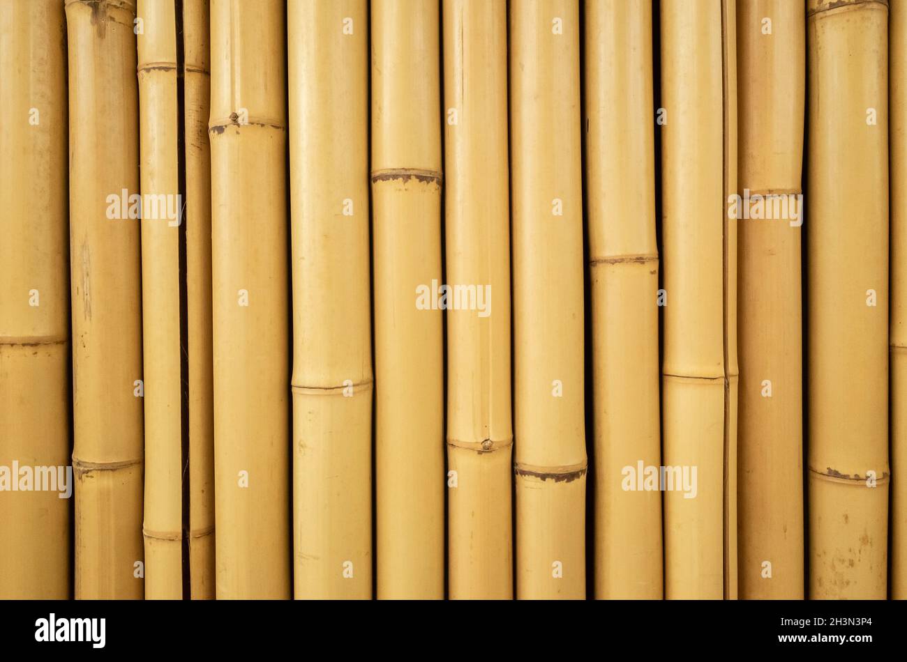 Yellow bamboo craft background Stock Photo - Alamy