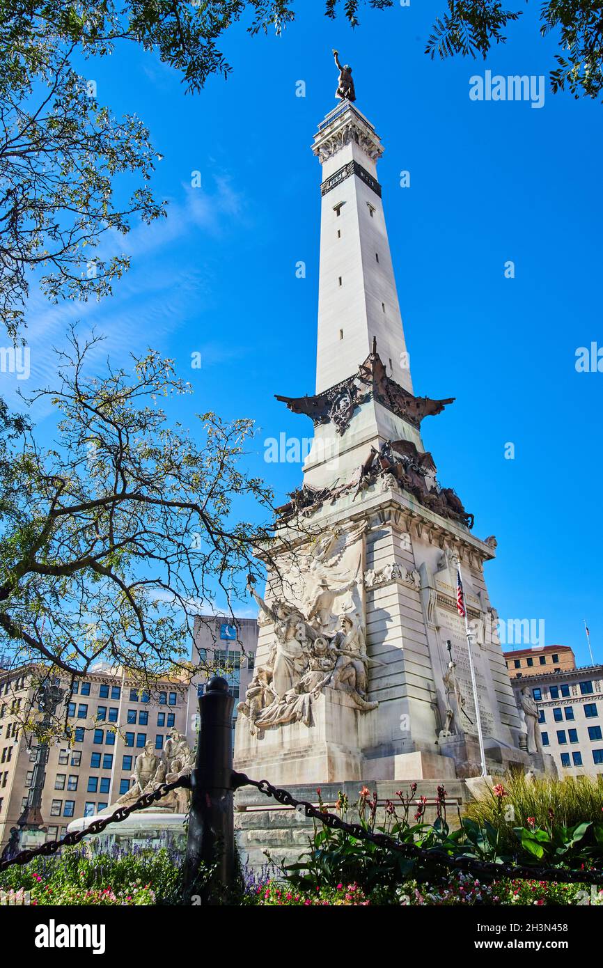 View through trees and against barrier of Soldiers and Sailors Monument ...