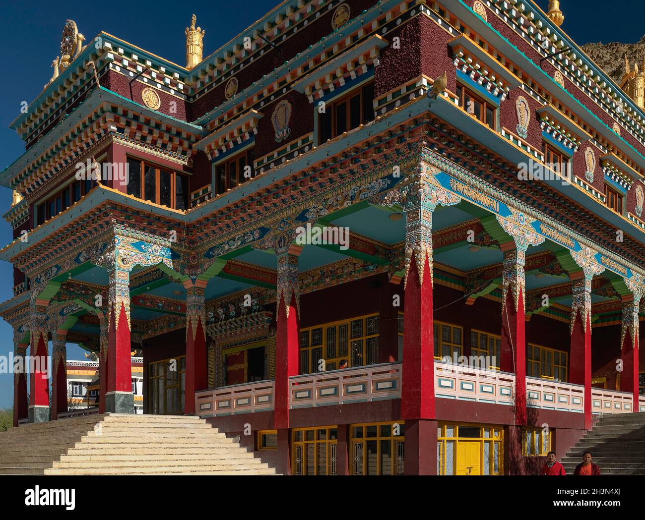 Colorful Buddhist monastery, Gompa, against Himalaya backdrop and blue ...