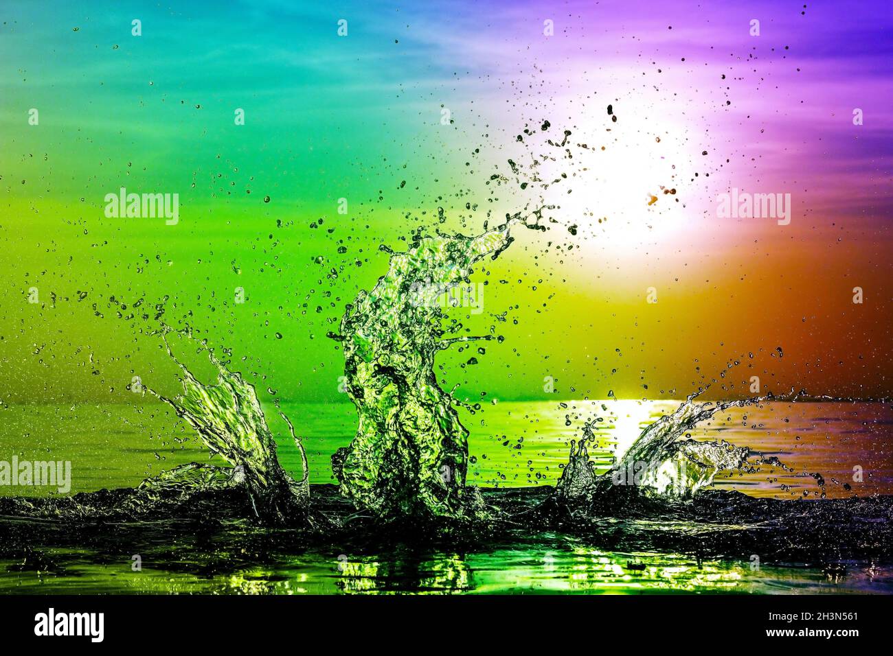 Rainbow colorful water splash background at sunset. Cool, fresh ...