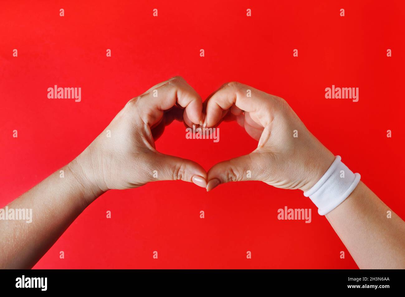 Hands making heart sign Stock Photo - Alamy