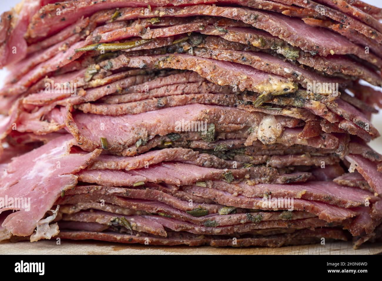 Stack of sliced pastrami meat Stock Photo - Alamy