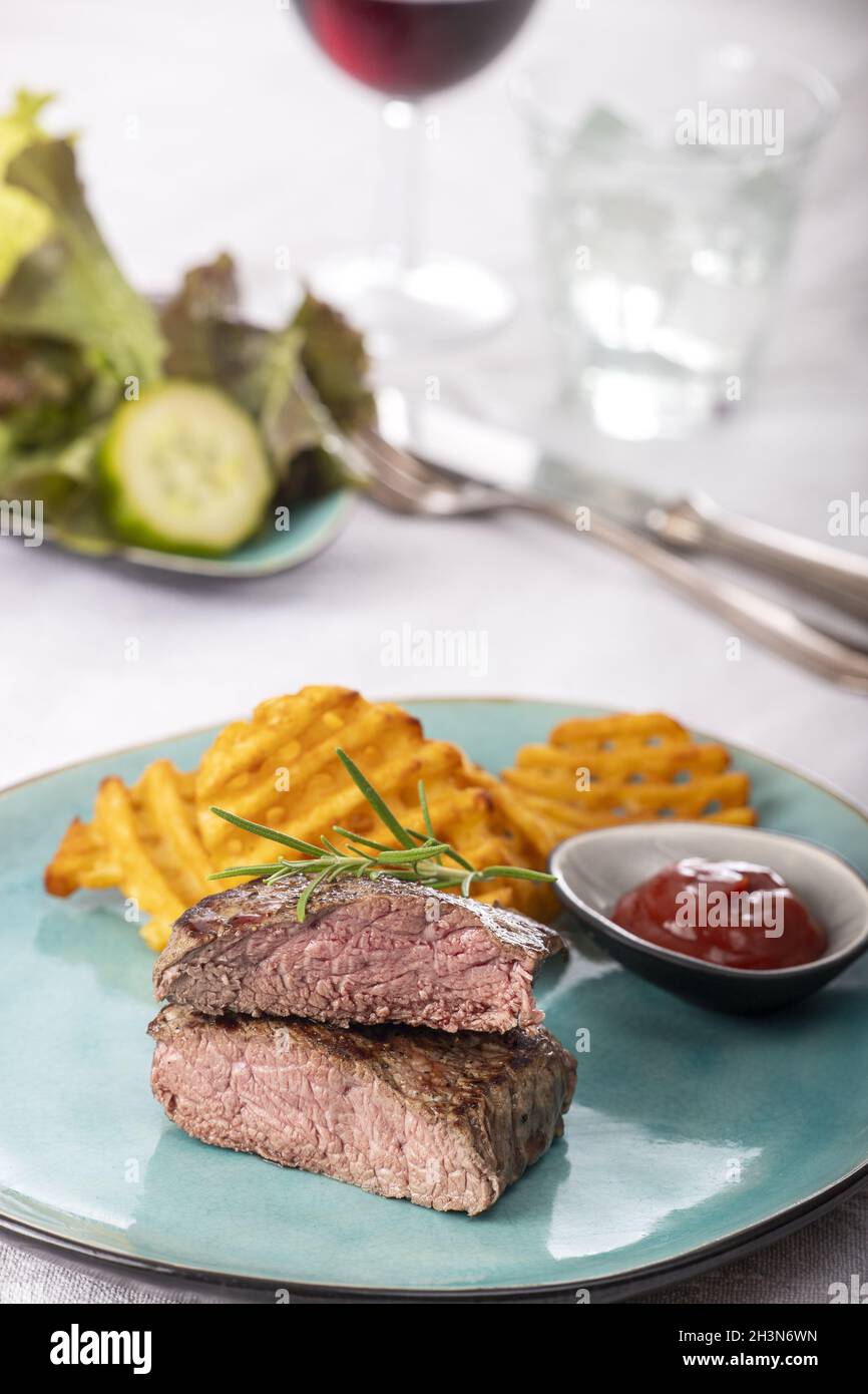 Grilled steak with fresh potato grids Stock Photo - Alamy