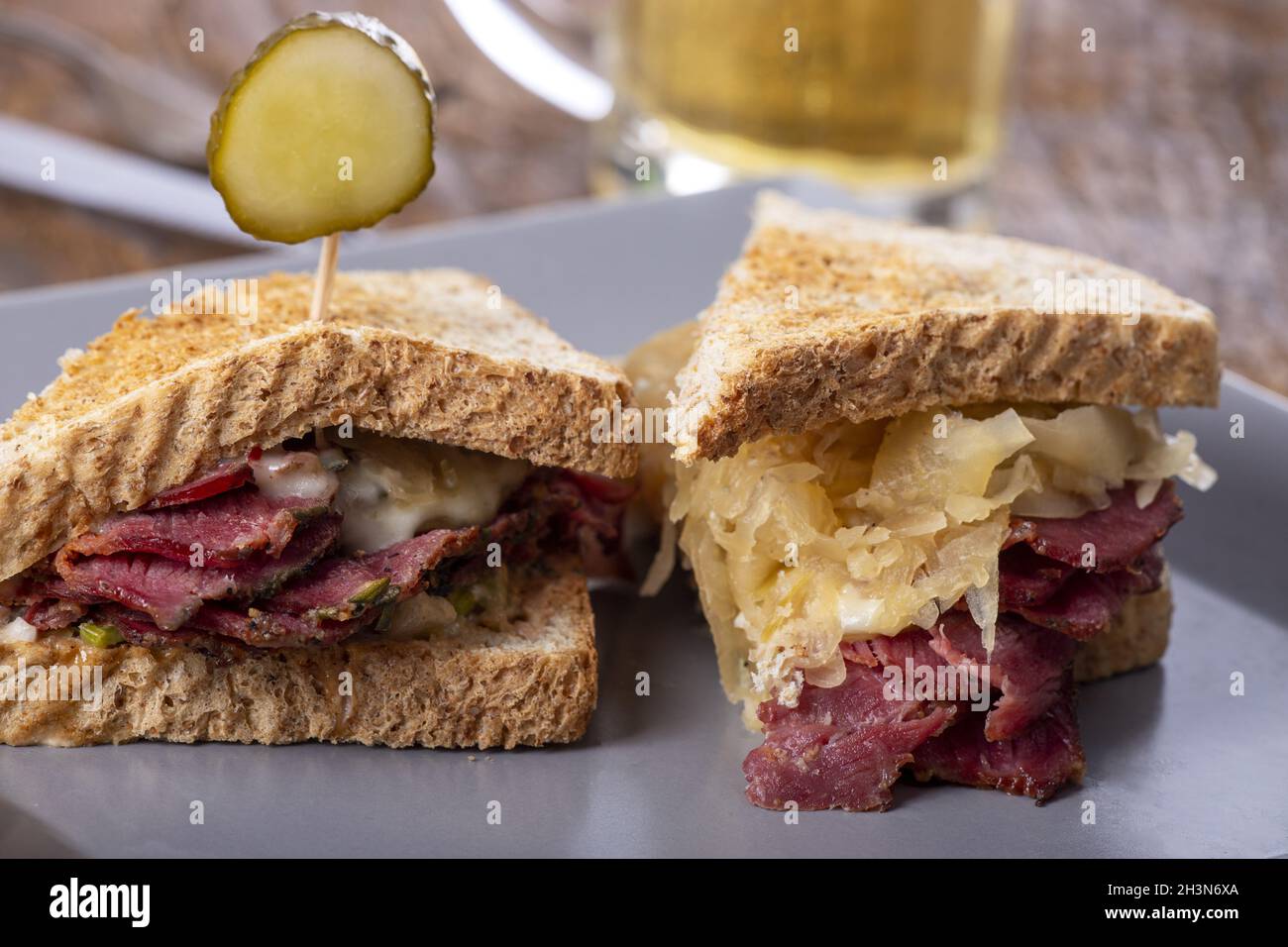 Reuben sandwich on a plate with fries Stock Photo - Alamy