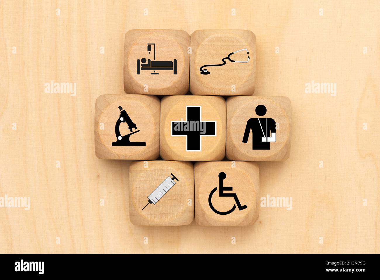 Medical care as a symbol on wooden cubes Stock Photo - Alamy