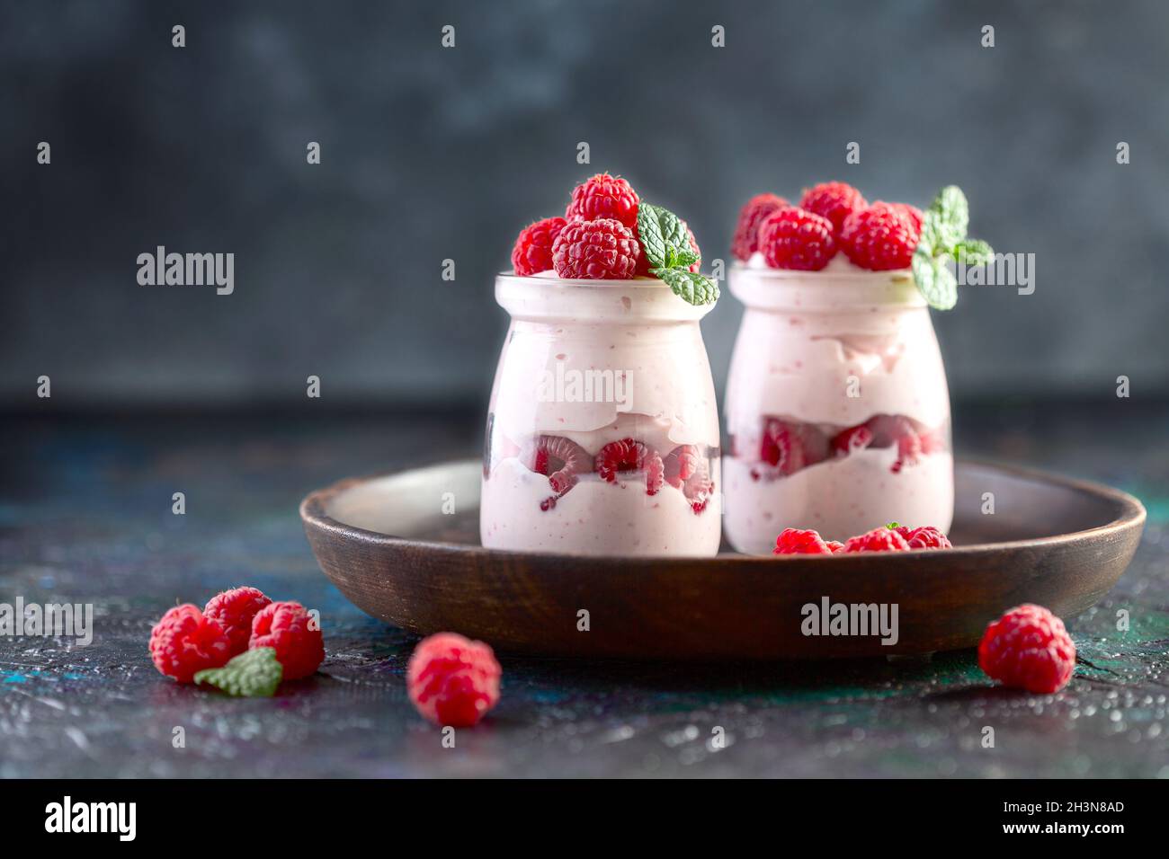 Homemade yogurt with raspberries Stock Photo - Alamy
