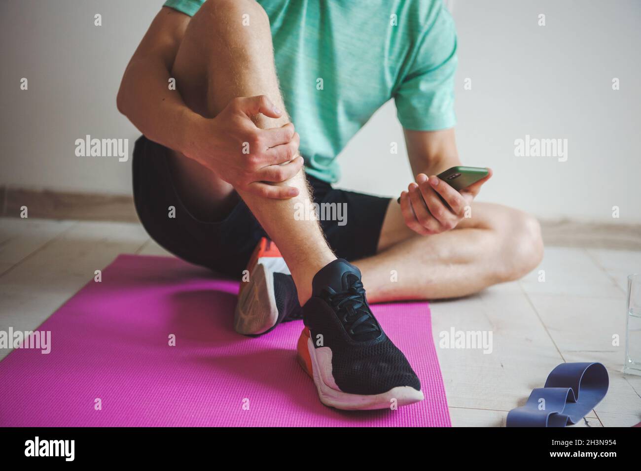 Online training.Man waiting for the next fitness exercise. Health care ...