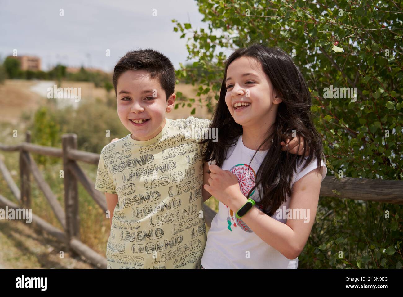 Children playing behind a fence hi-res stock photography and images - Alamy