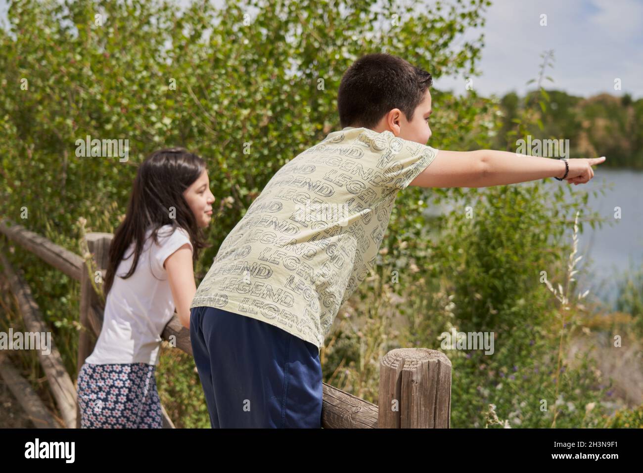 Children playing on a park bench hi-res stock photography and images ...